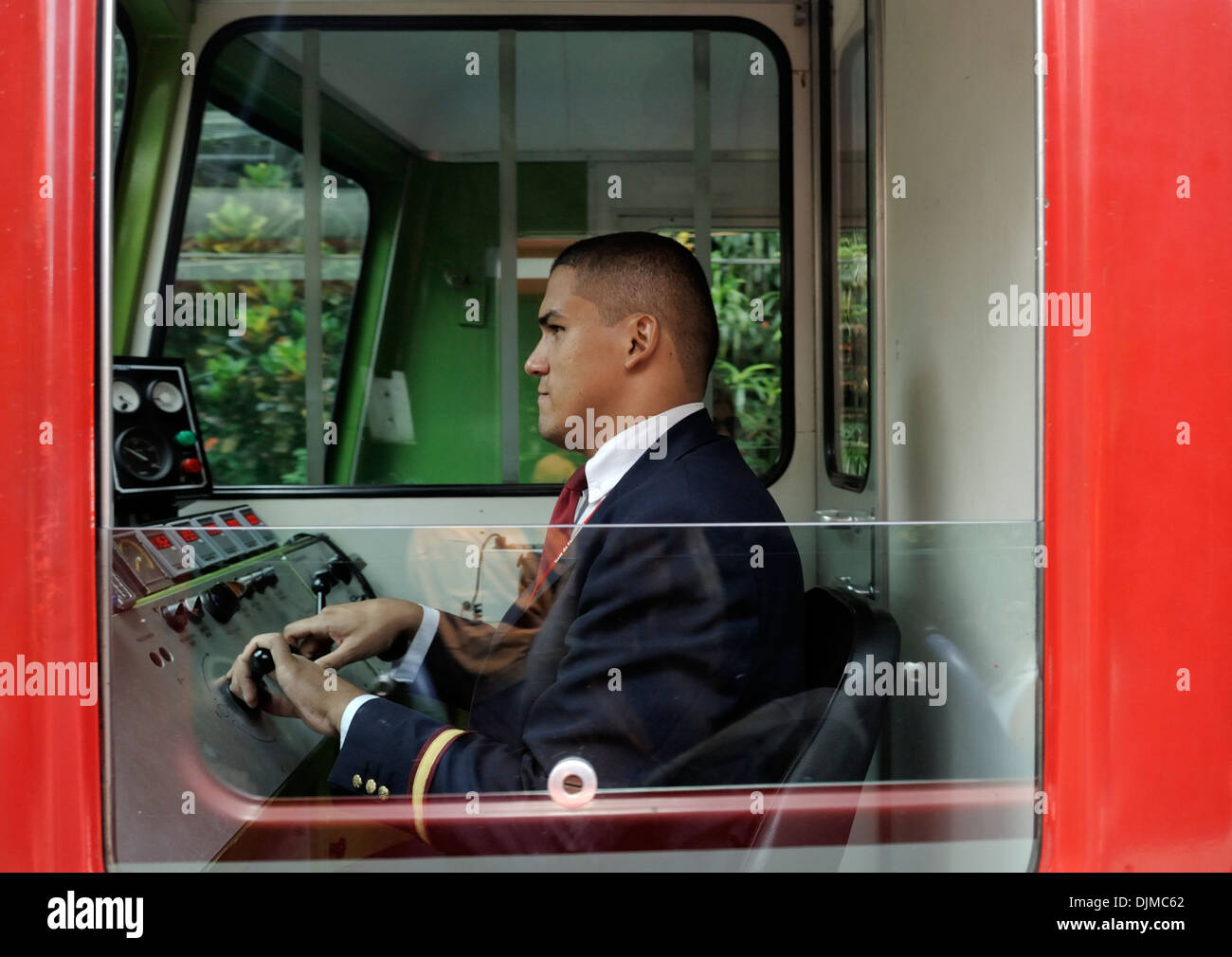 Rio de Janeiro, Brazil: Train engineer driving the famous train "Trem ...