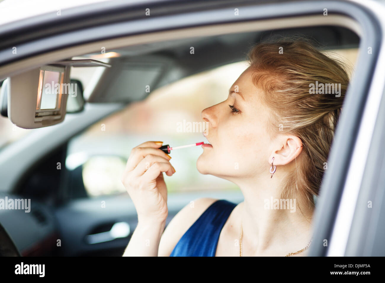 Woman Putting On Makeup While Driving