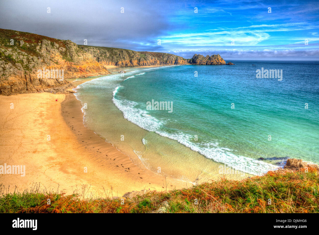 Turquoise sea on Cornish beach with mist and blue sky, Porthcurno ...