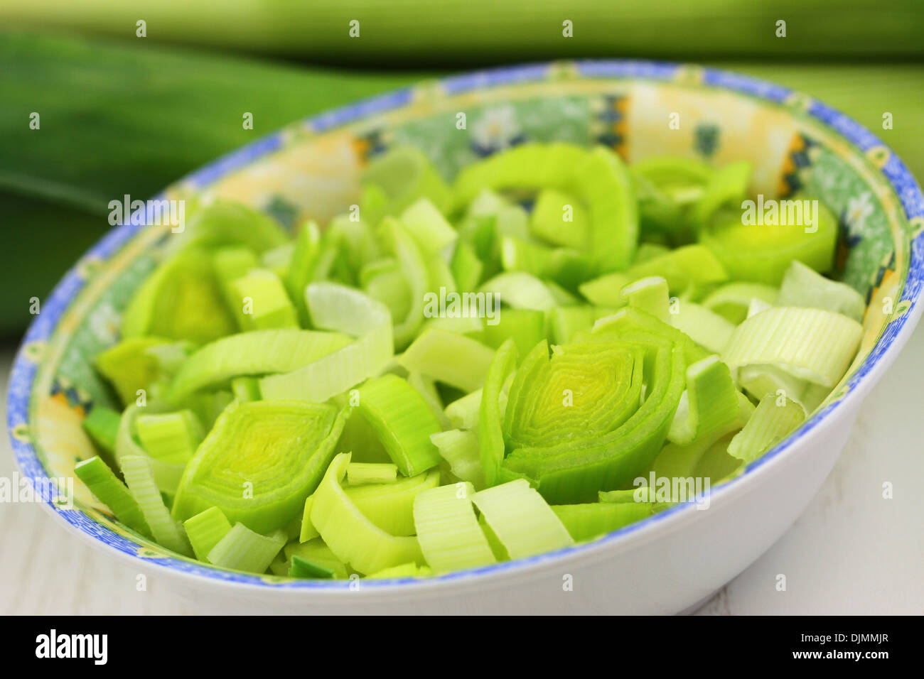 Sliced leek in porcelain bowl, close up Stock Photo - Alamy