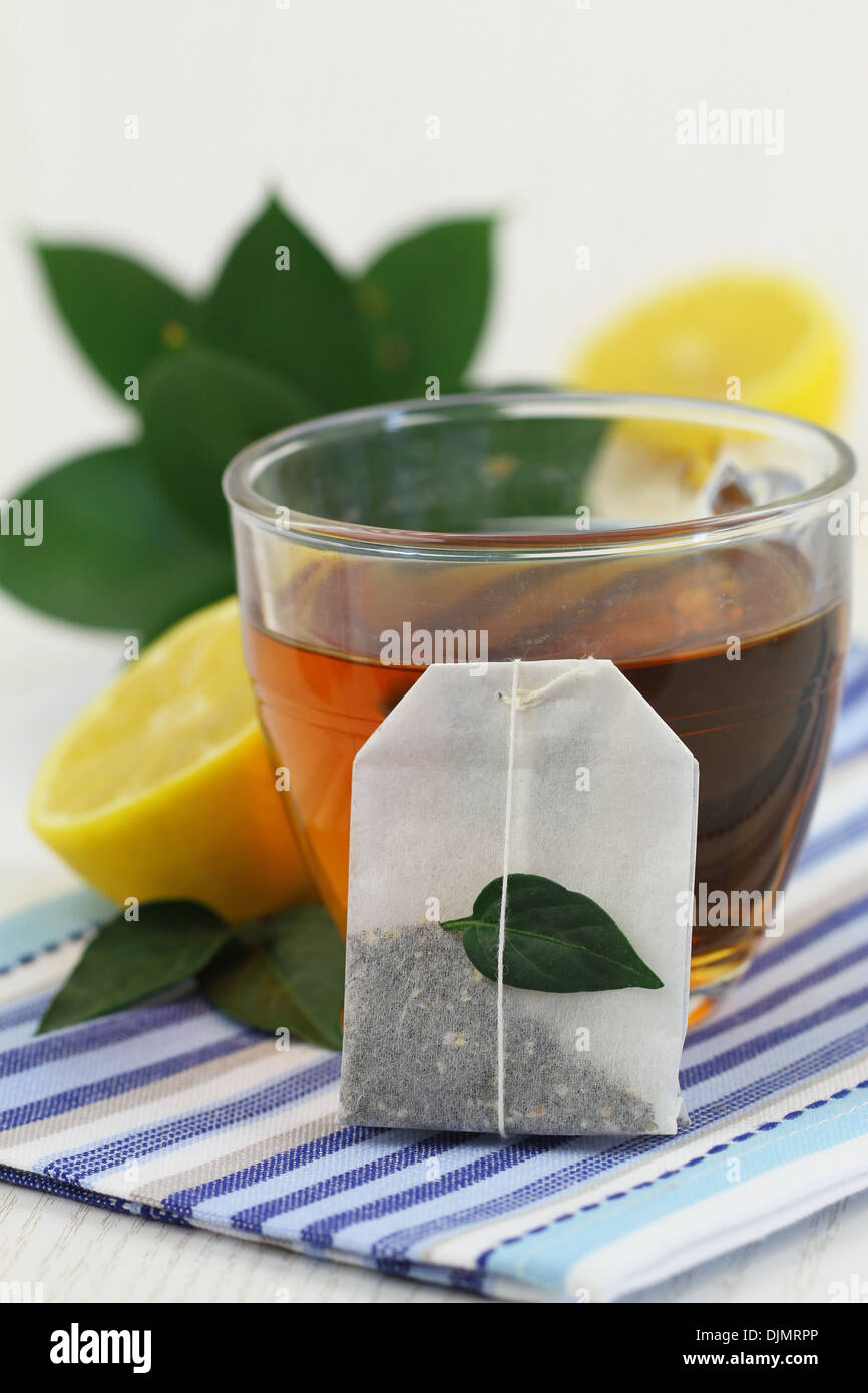 Tea bags, tea and fresh lemon Stock Photo - Alamy