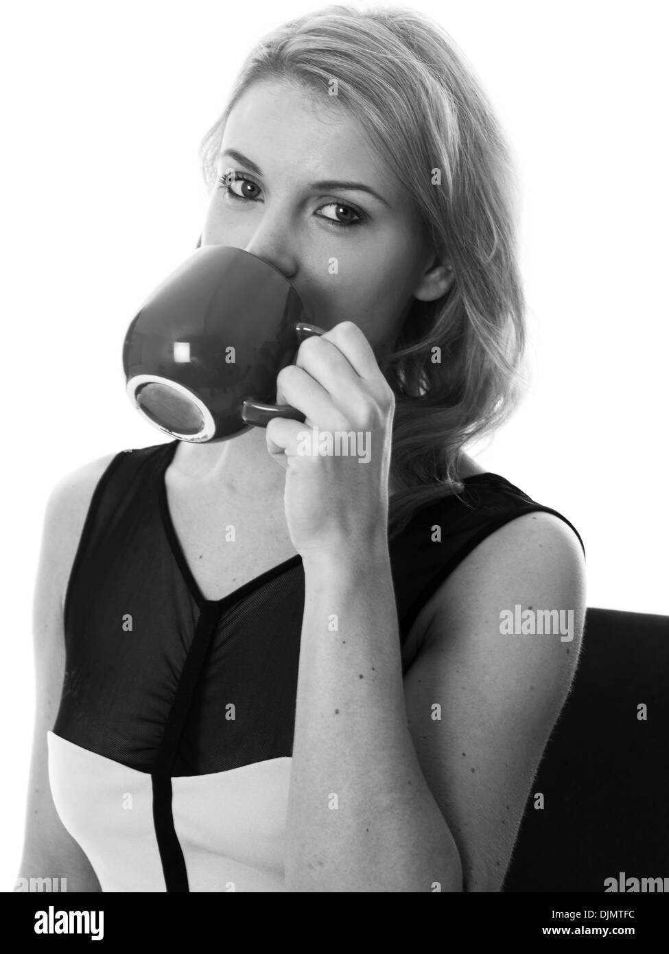 Model Released. Young Woman Drinking a Mug of Tea Stock Photo - Alamy