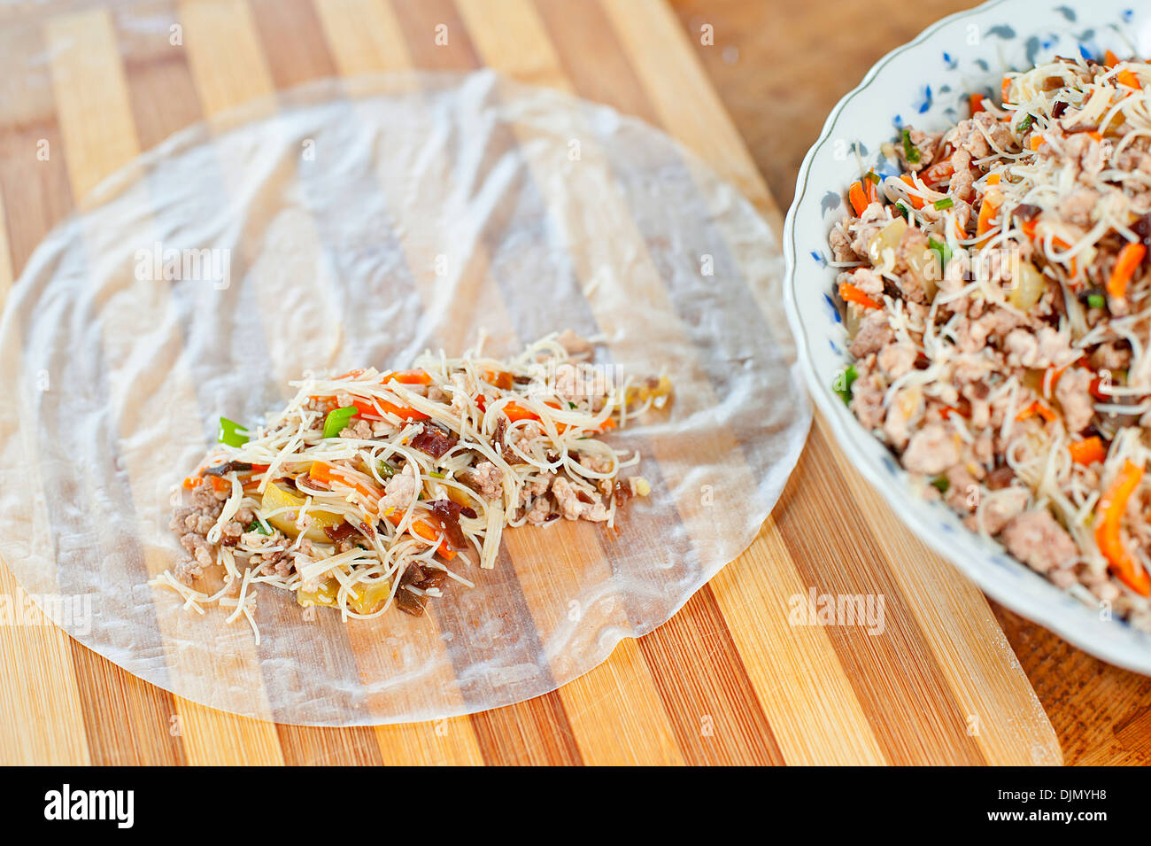 Cooking spring rolls. Filling in bowl Stock Photo - Alamy