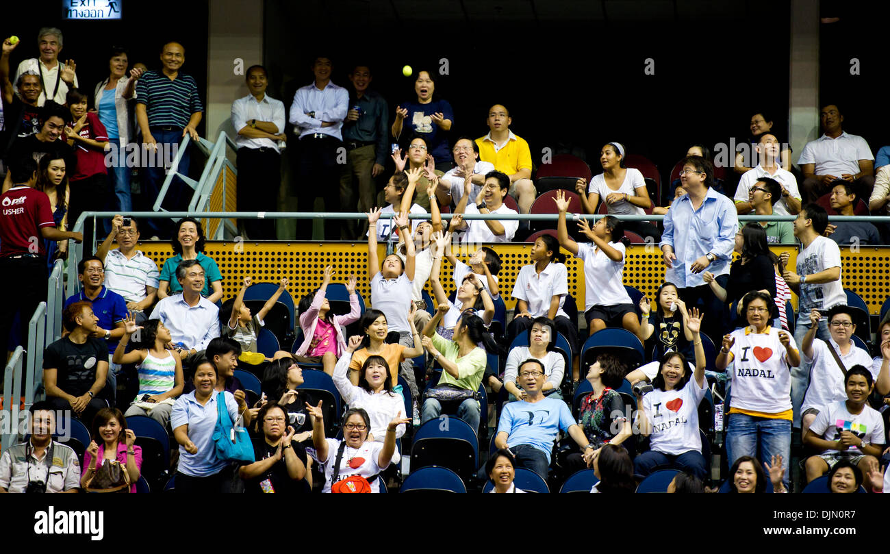 Sept. 30, 2010 - Bangkok, Thailand - Spectators try to grab a tennis ...