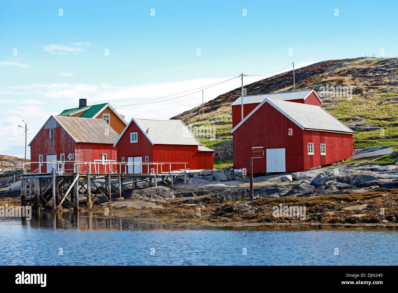 Traditional Norwegian coastal village with red wooden houses Stock ...