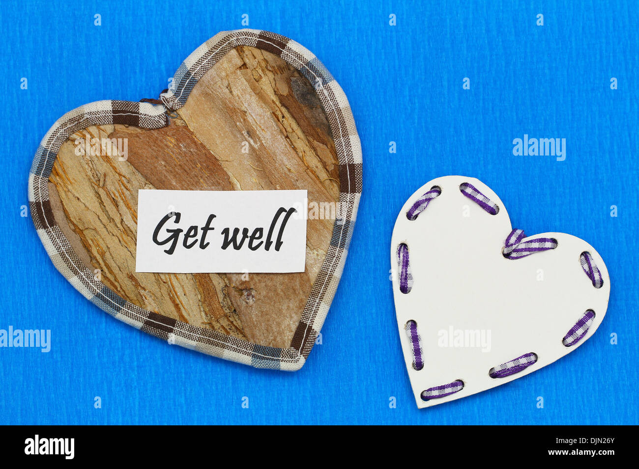 Get well card with wooden hearts on blue background Stock Photo - Alamy