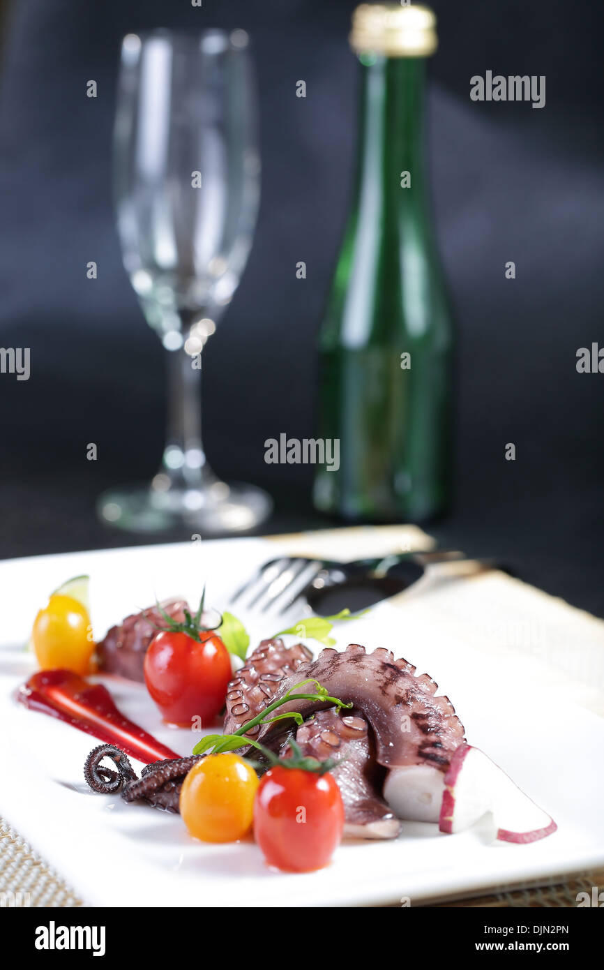 Close up Steam Octopus on the white dish Stock Photo - Alamy