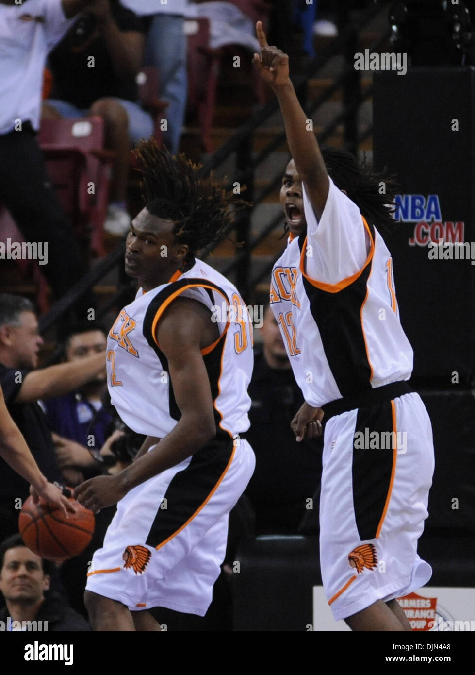 McClymond's Damario Sims, #12, reacts after a dunk by teammate Damon ...