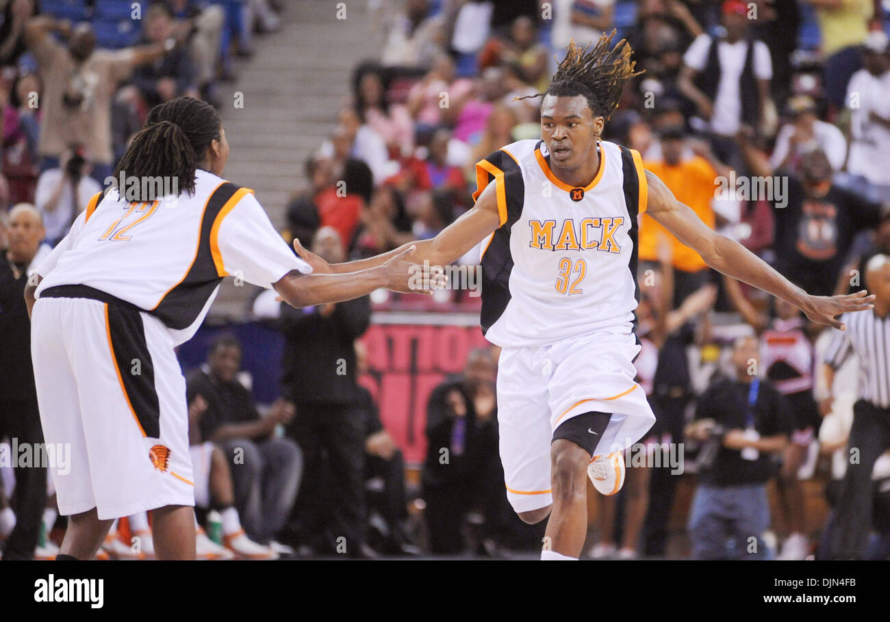 McClymond's Damon Powell, #32, is congratulated by teammate Damario ...