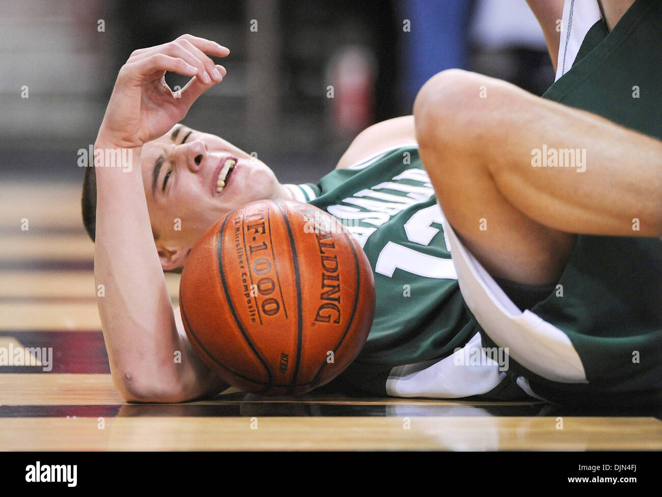 De La Salle's Beau Levesque, #12, grimaces after landing hard on the ...