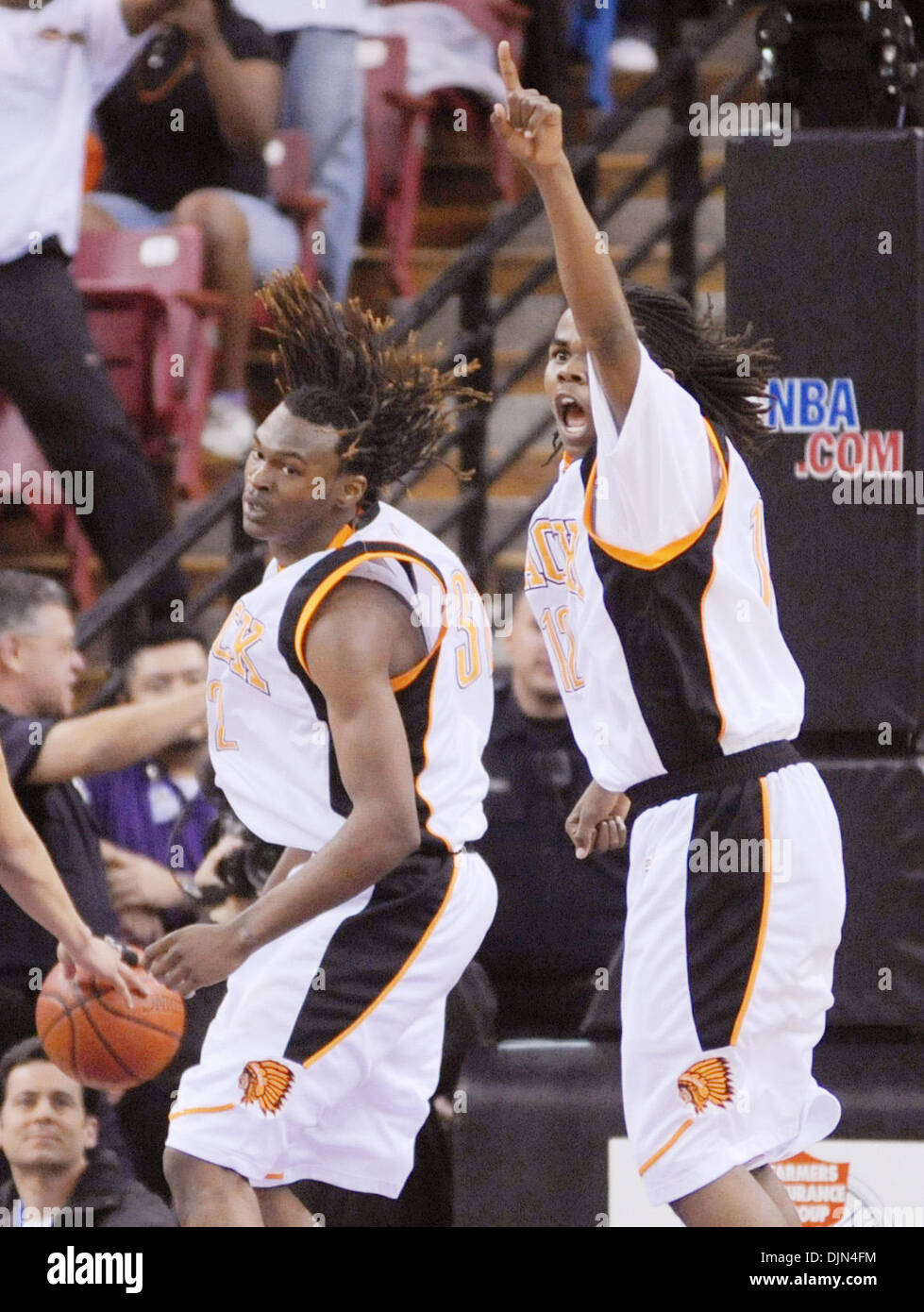 McClymond's Damario Sims, #12, reacts after a dunk by teammate Damon ...