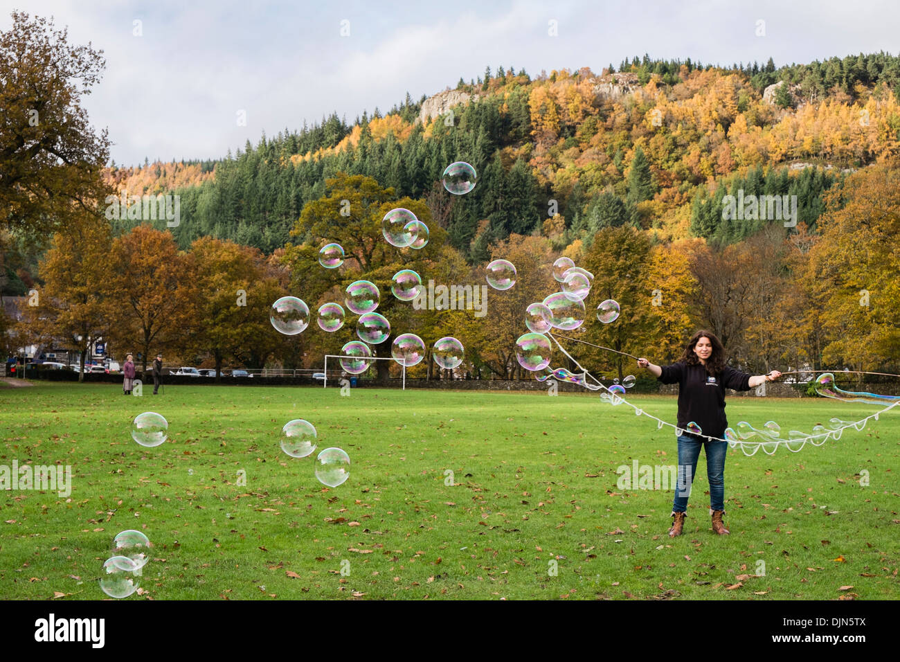 Woman with a bubble blower hi-res stock photography and images - Alamy