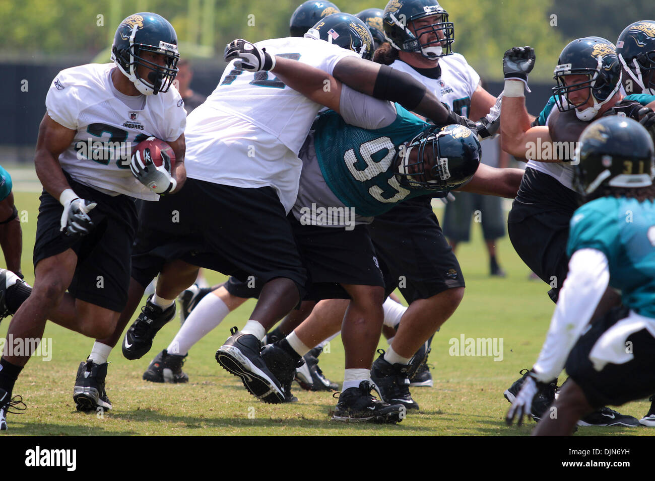 Clint Ingram gets mauled by offensive linemenl during the Jacksonville ...