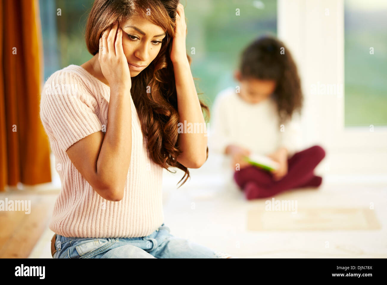Stressed mother with child Stock Photo - Alamy