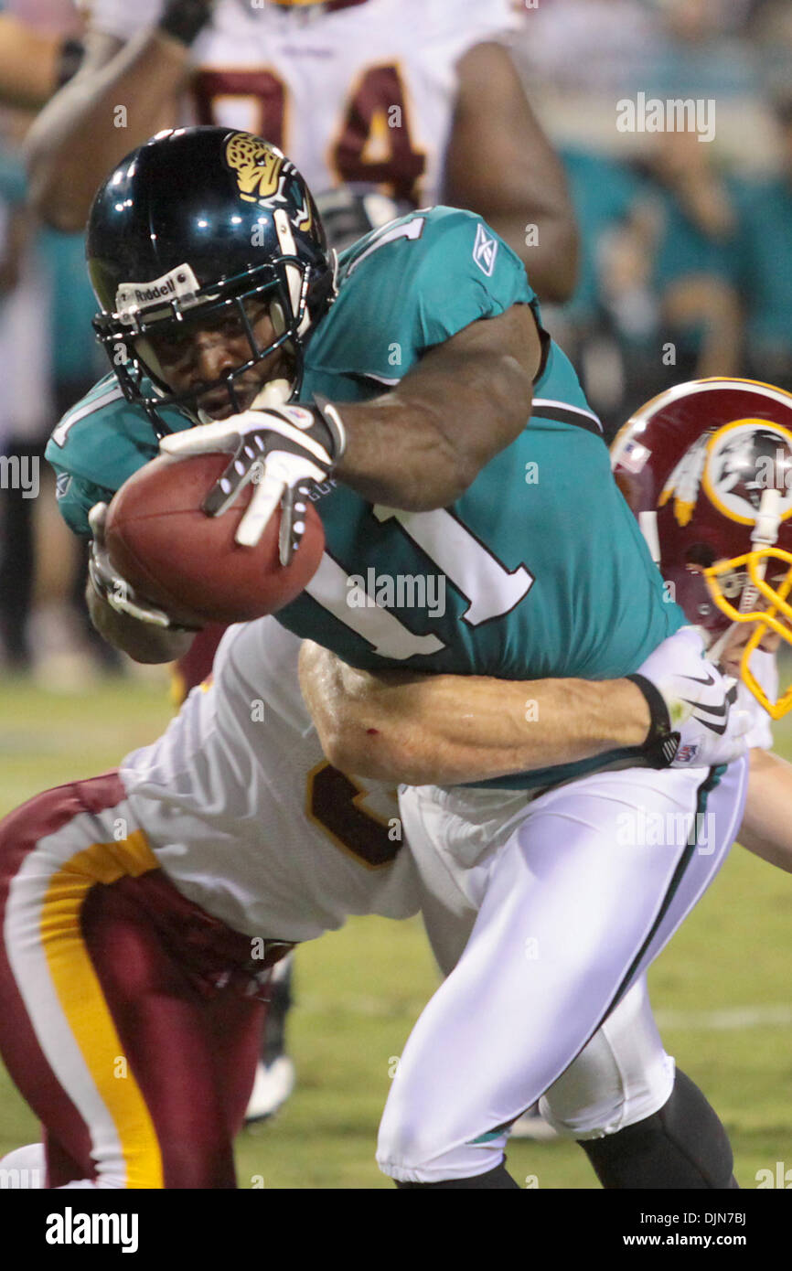 Mike Sims-Walker stretches for the goal line during the Jacksonville ...