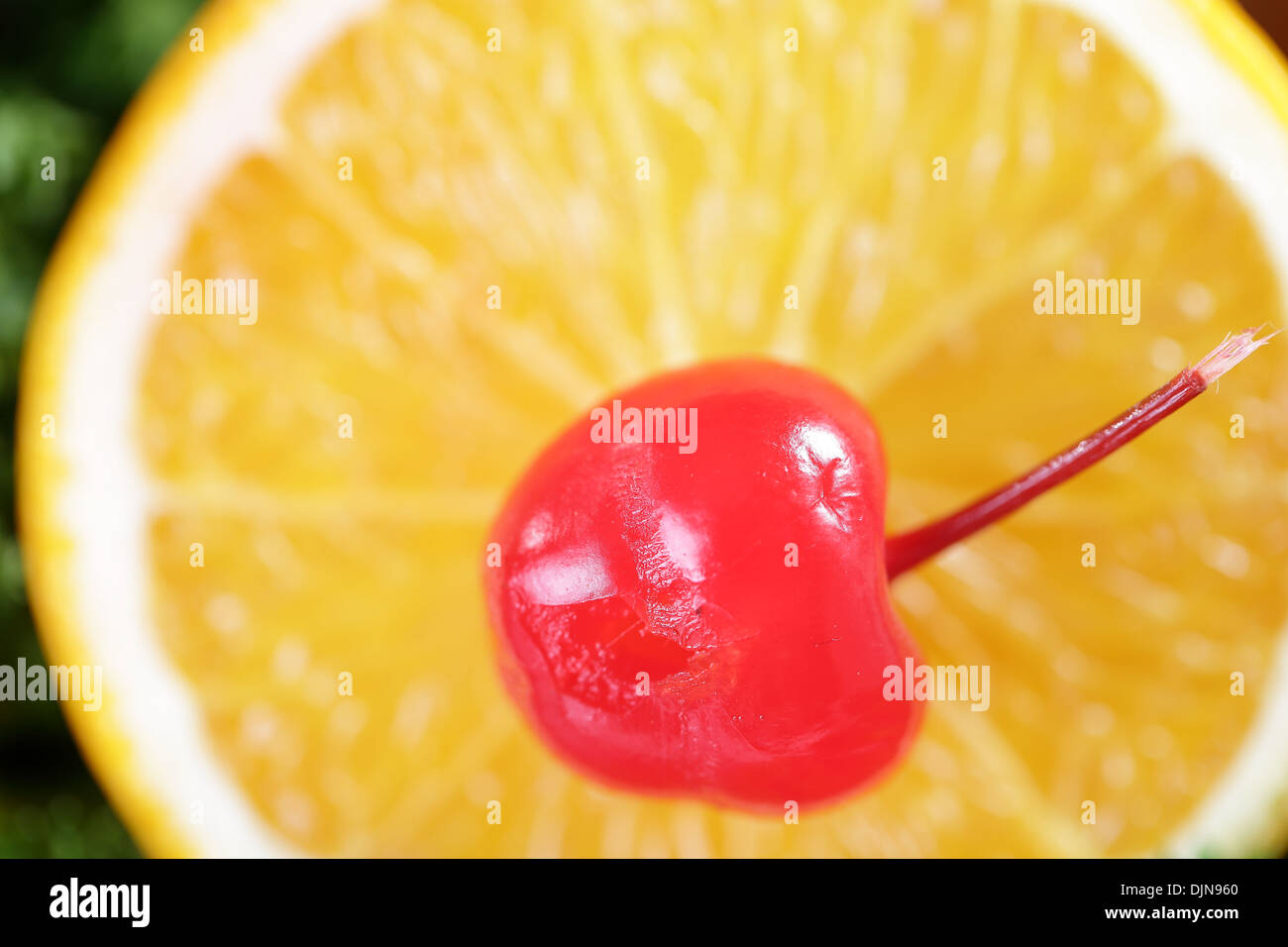 Close up red cherry stick with orange Stock Photo - Alamy