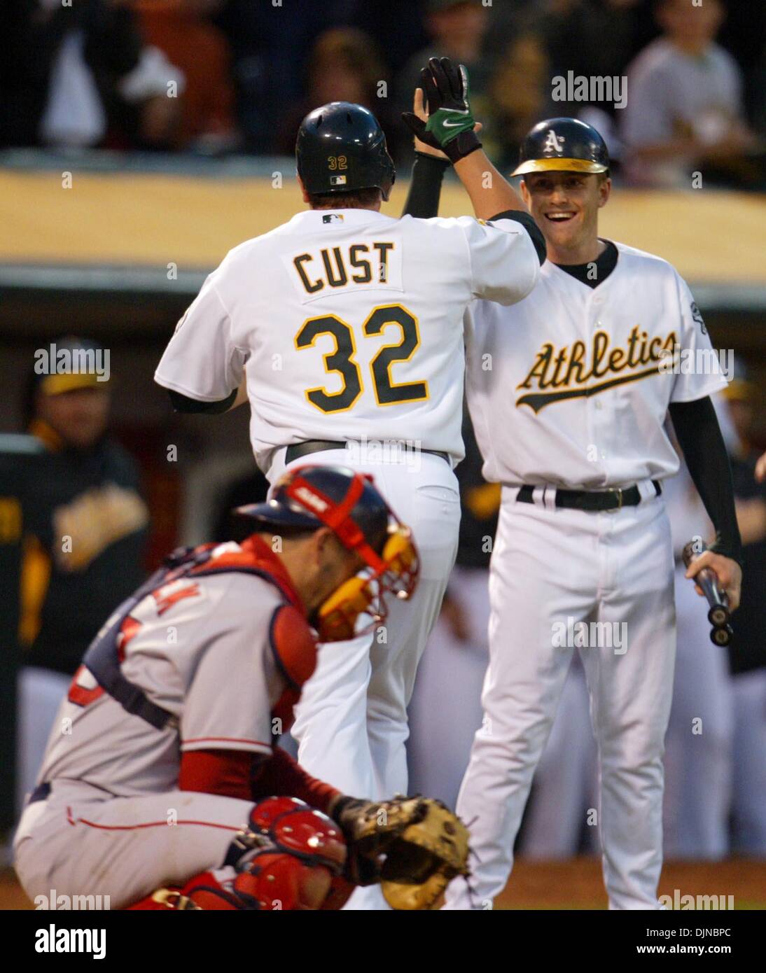 Oakland Athletics' designated hitter Jack Cust, left, gets a high-five ...