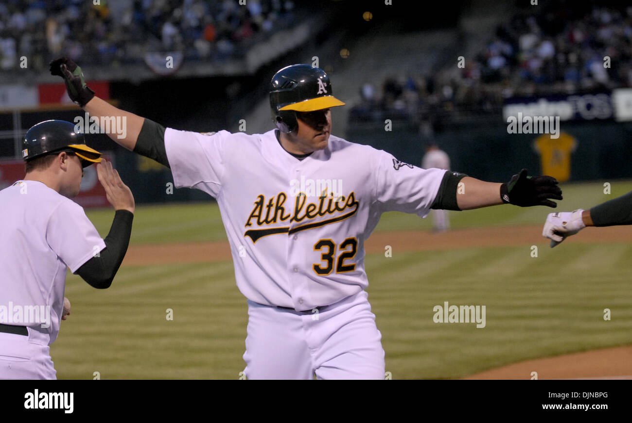 Athletics' Jack Cust (#32) celebrates his home run in the second inning ...