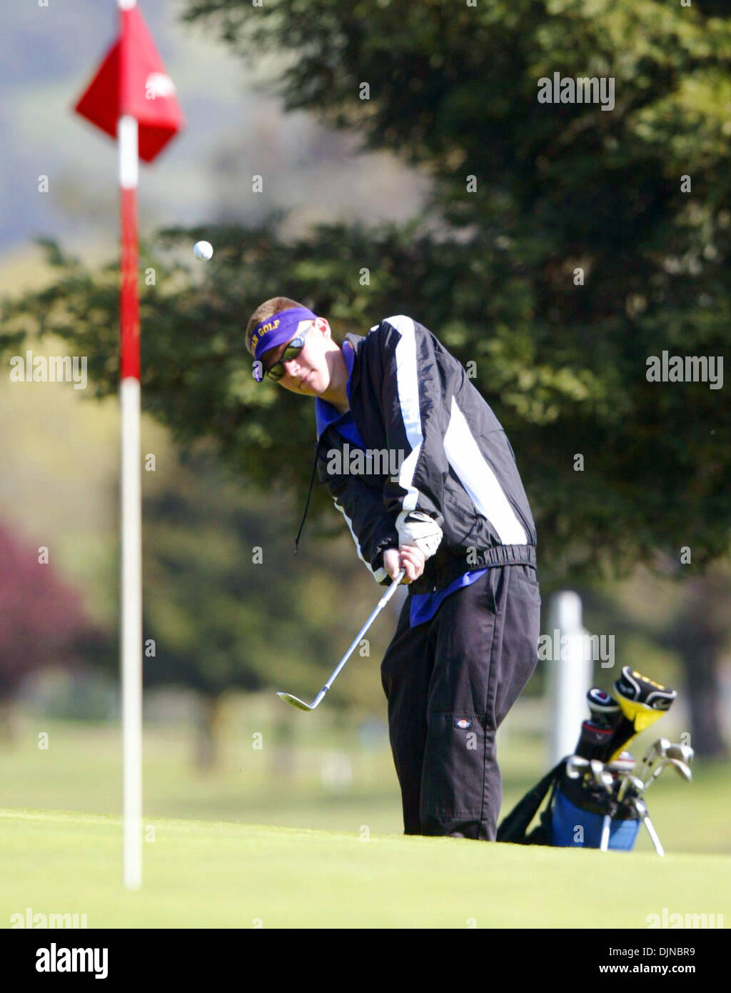 Kennedy's Sean Hendrickson chips onto the green on the 11th hole of the ...