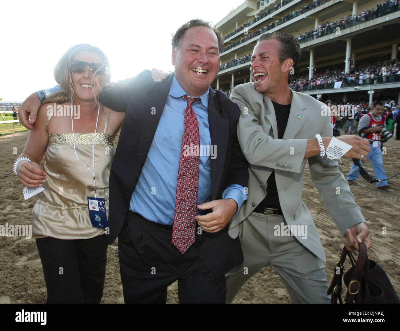 Trainer Rick Dutrow, center, with exercise rider Michelle Nevin, left ...