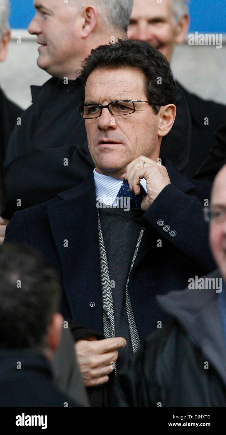 England manager Fabio Capello adjusts his tie as he takes his seat ...