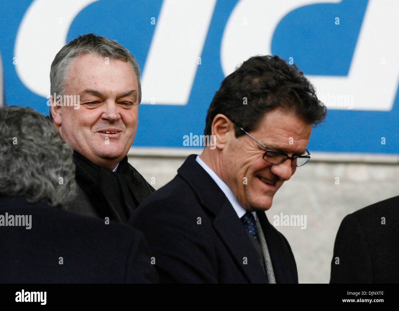 England manager Fabio Capello enjoys a laugh with Bolton chairman Phil ...
