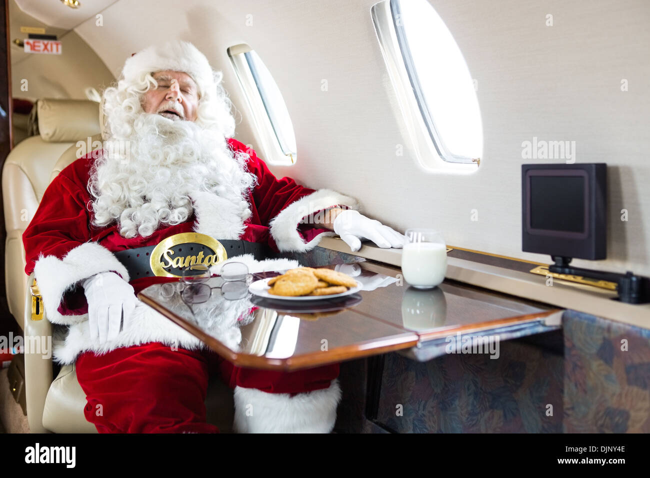 Santa Sleeping In Private Jet Stock Photo - Alamy