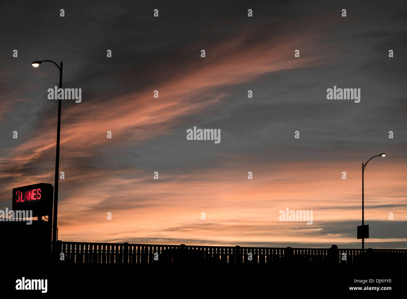 sunset landscape with neon sign Stock Photo - Alamy