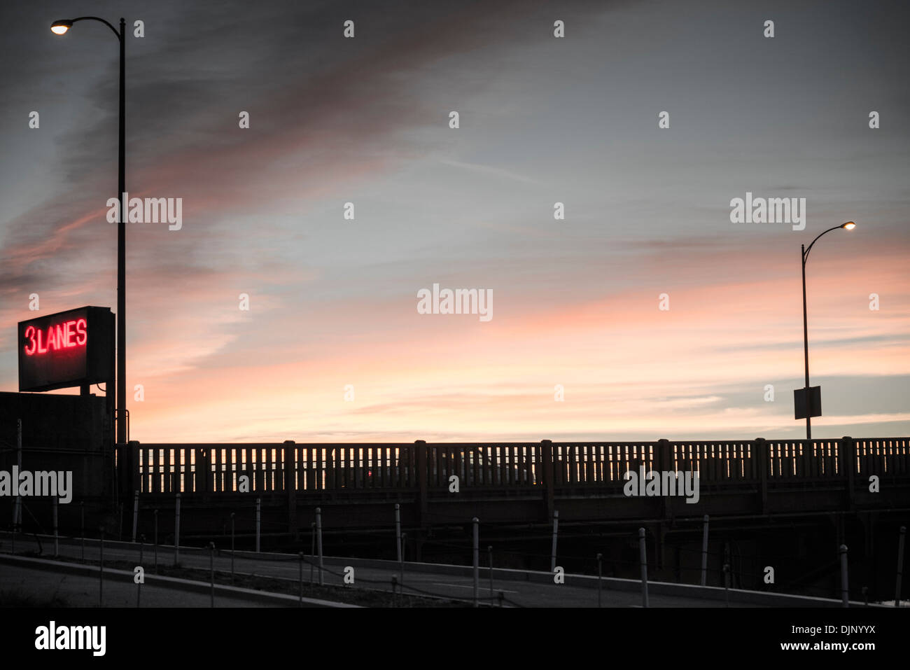 sunset landscape with neon sign Stock Photo - Alamy