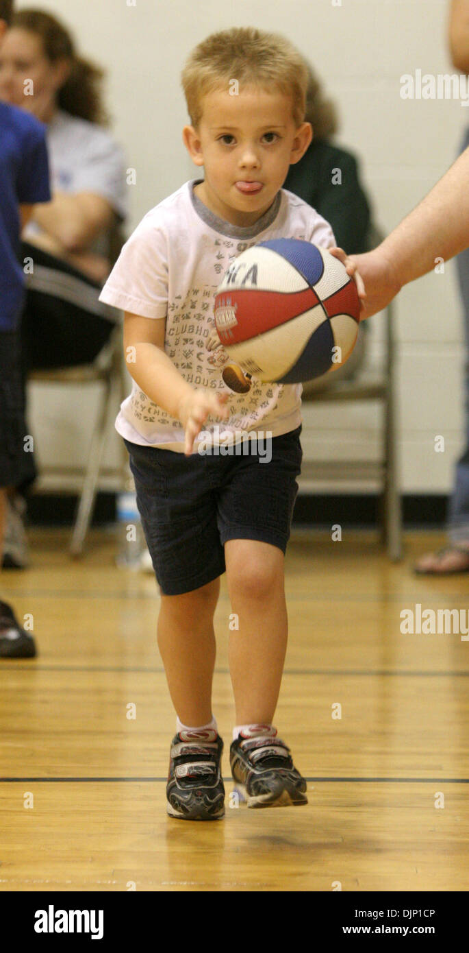 Daniel Benefiel, 4, dribbles through a drill, and sticks out his tongue ...