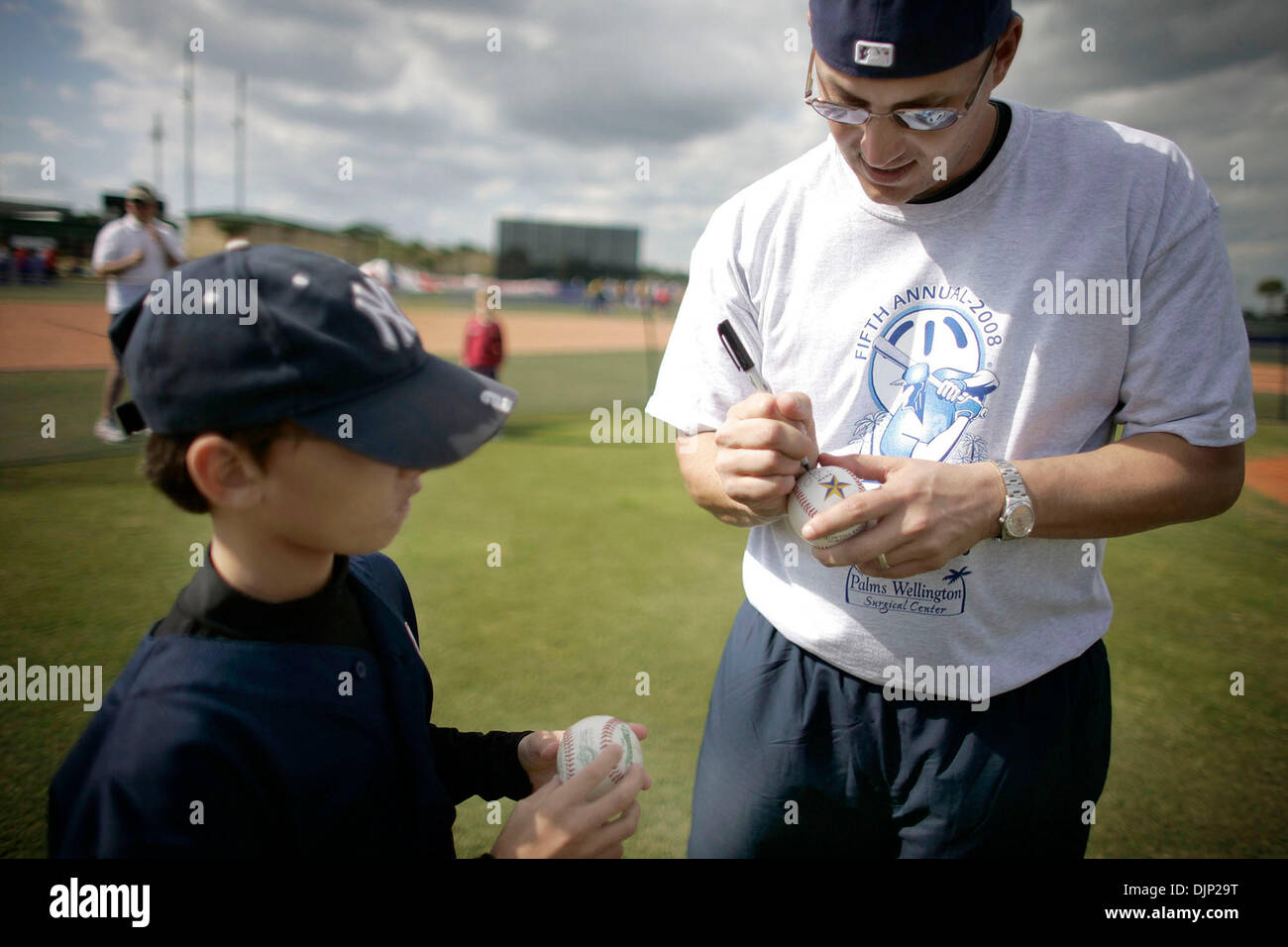 Signs an autograph for a young fan hi-res stock photography and images ...