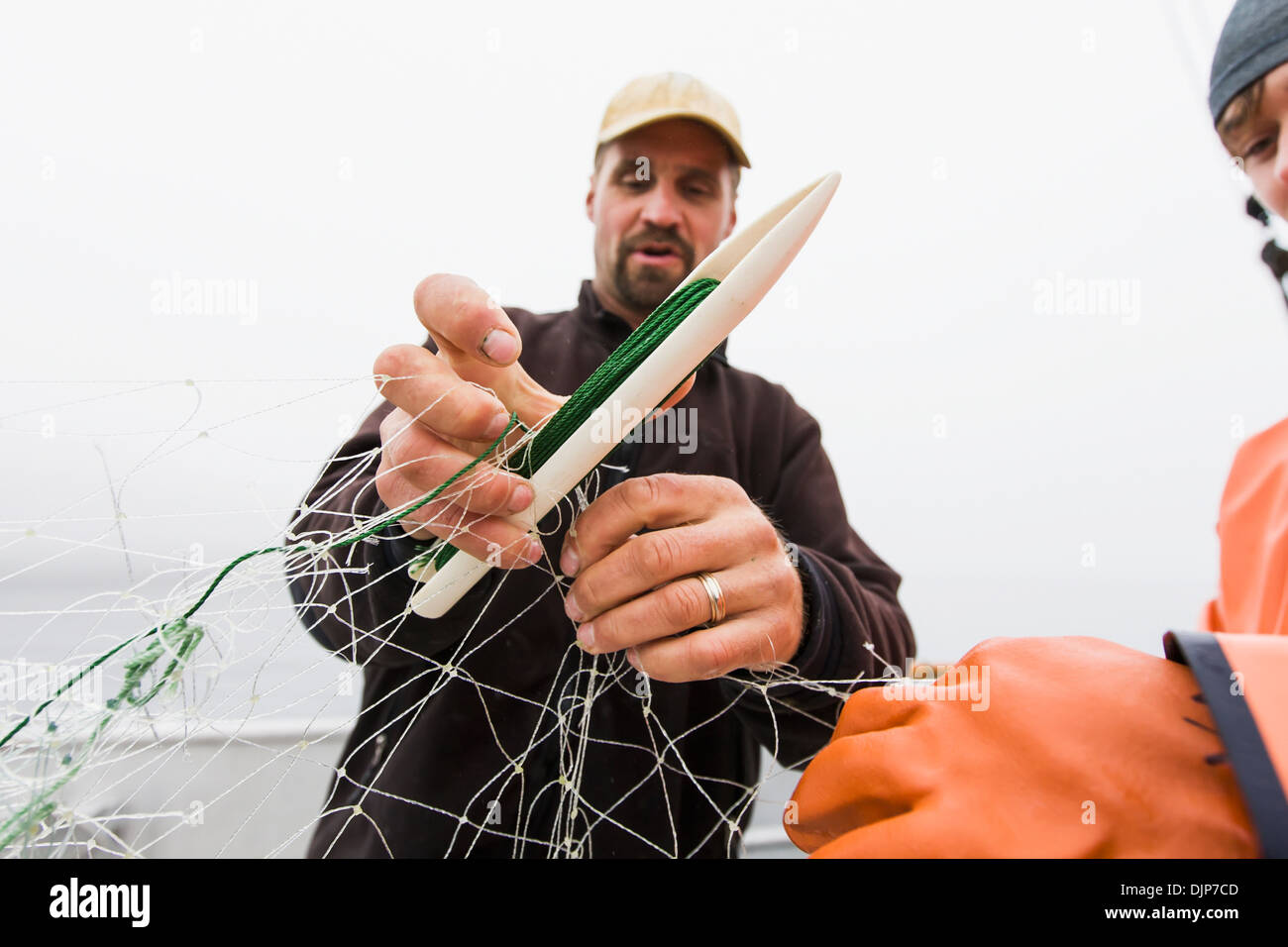 Repairing A Tear In A Gillnet While Commercial Sockeye Salmon Fishing ...