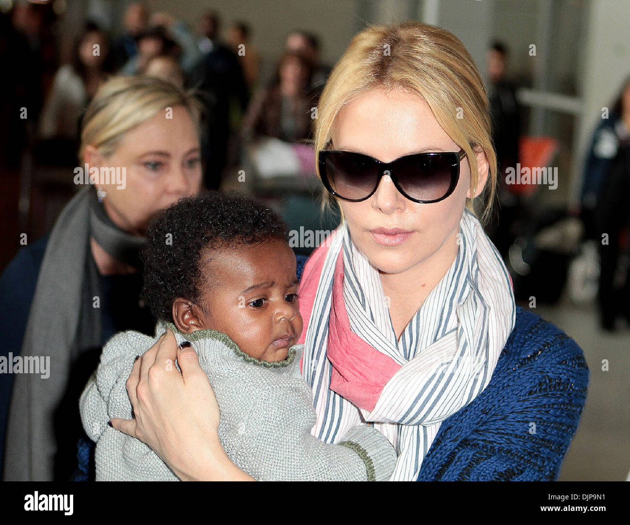 Charlize Theron and her son Jackson arrive at Charles de Gaulle airport ...