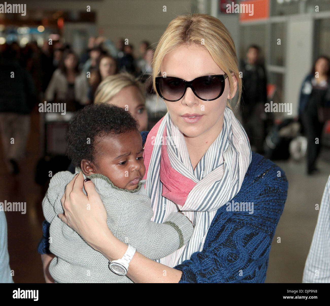 Charlize Theron and her son Jackson arrive at Charles de Gaulle airport ...