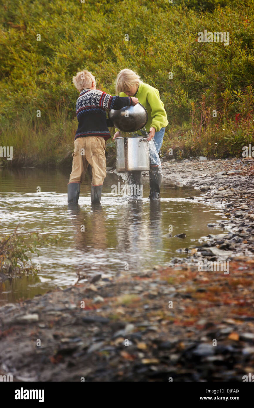 Brother And Sister Fetching Water Near Serpentine Hot Springs, Bering ...
