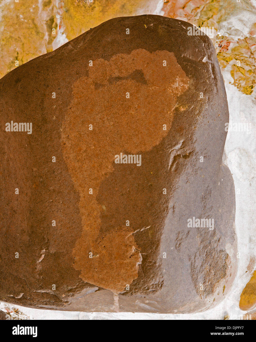 A light human footprint against a dark stone Stock Photo - Alamy