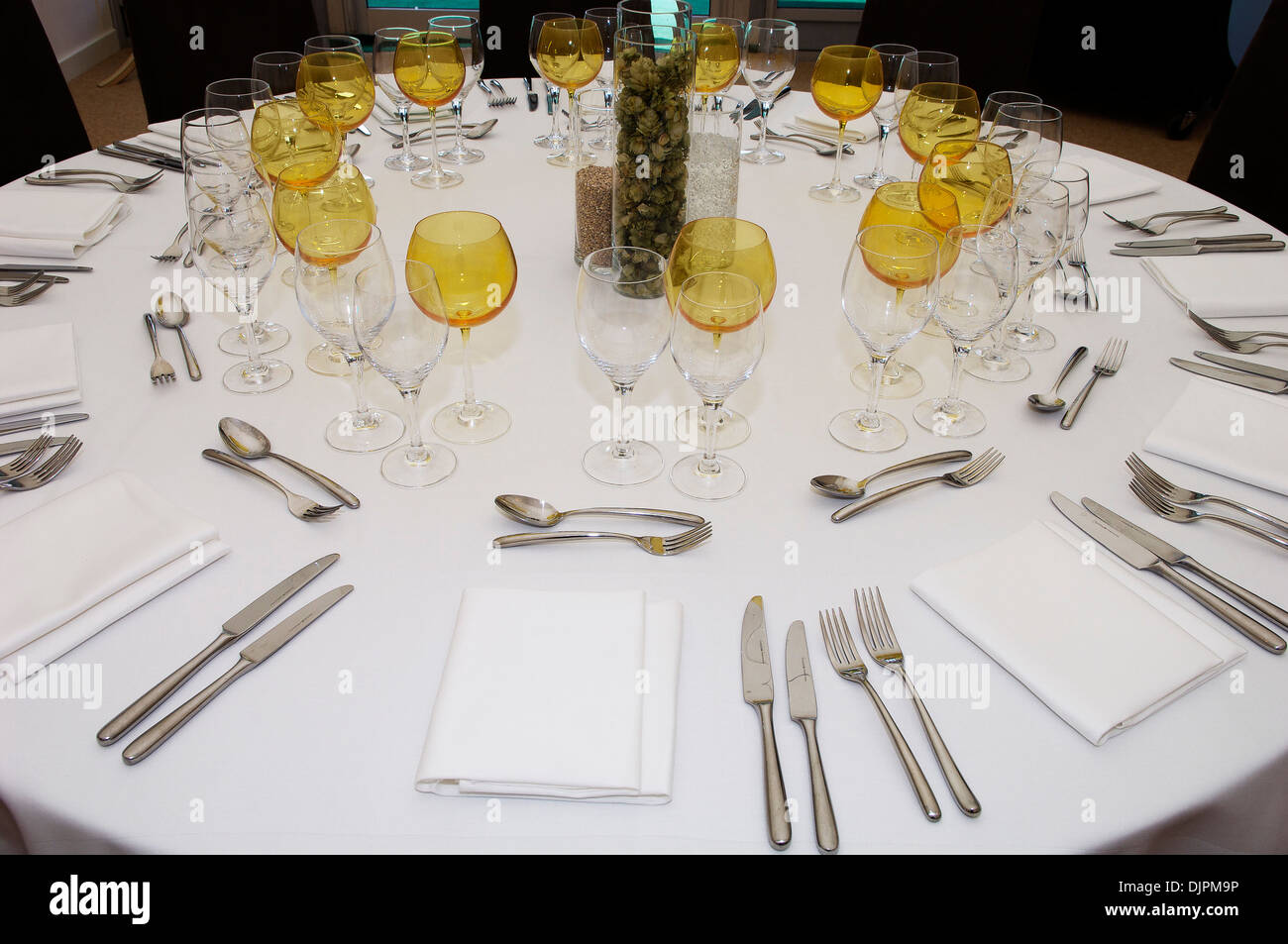 Table laid out ready for service at event Stock Photo - Alamy
