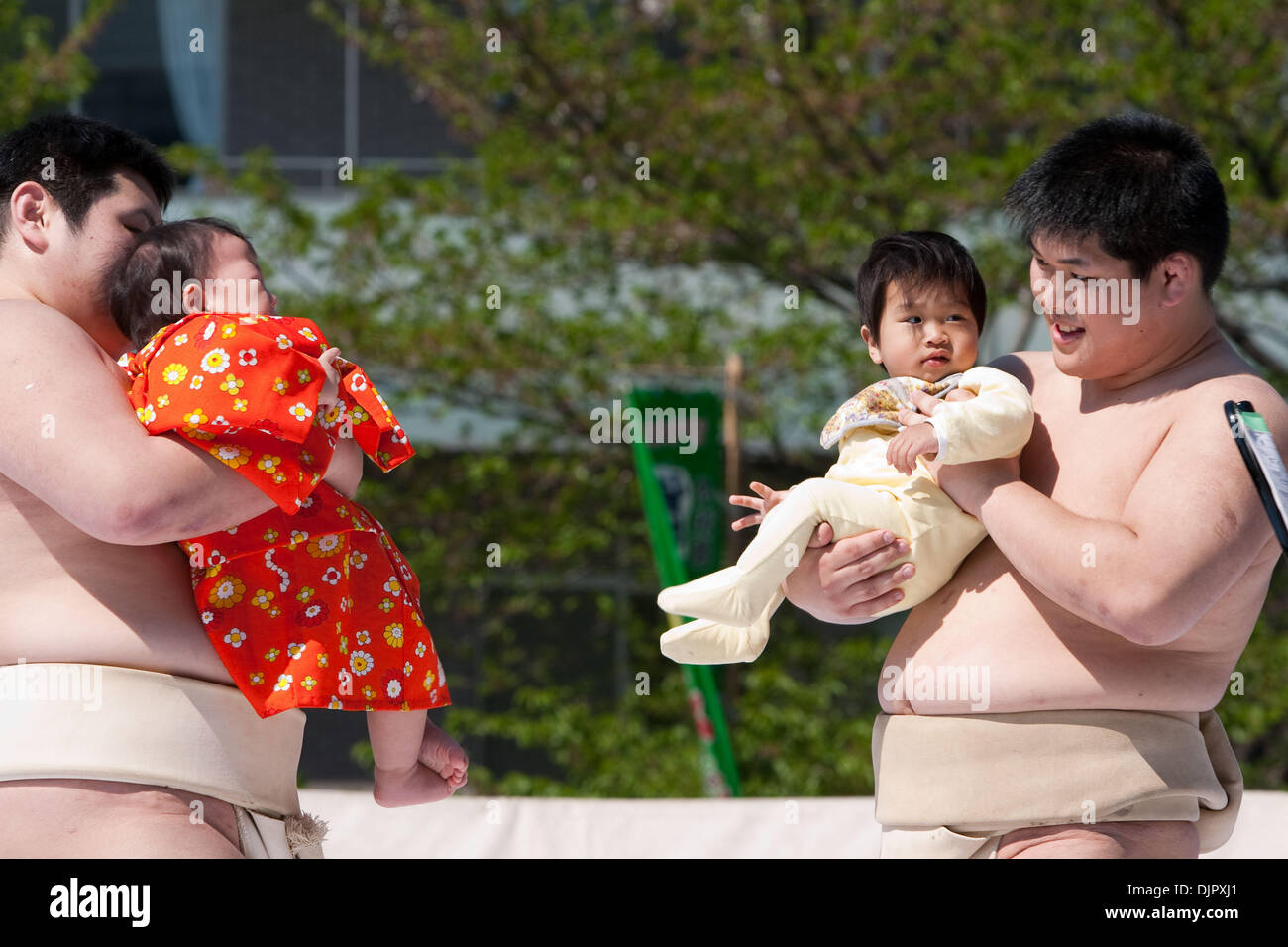Apr. 25, 2010 - Tokyo, Japan - As amateur sumo wrestlers hold babies ...