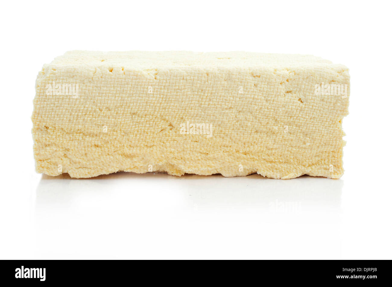a block of tofu on a white background Stock Photo - Alamy