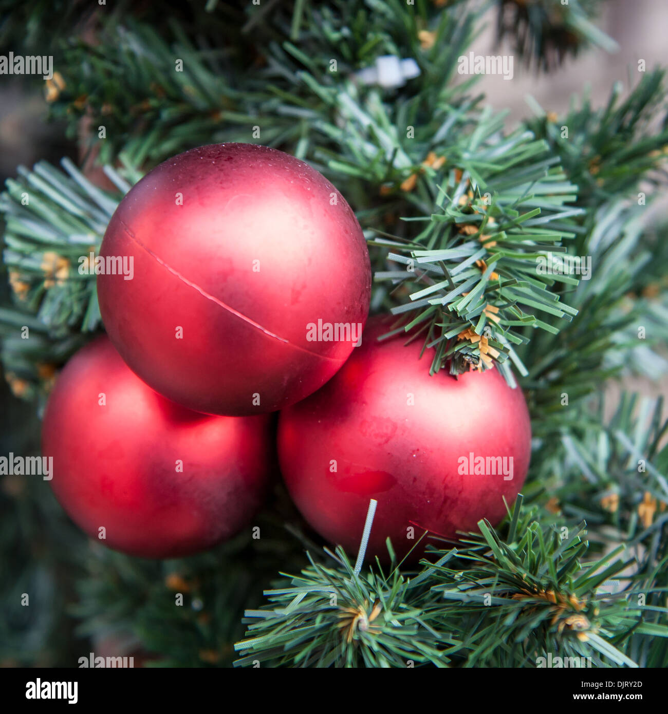 Red baubles and greenery Stock Photo - Alamy