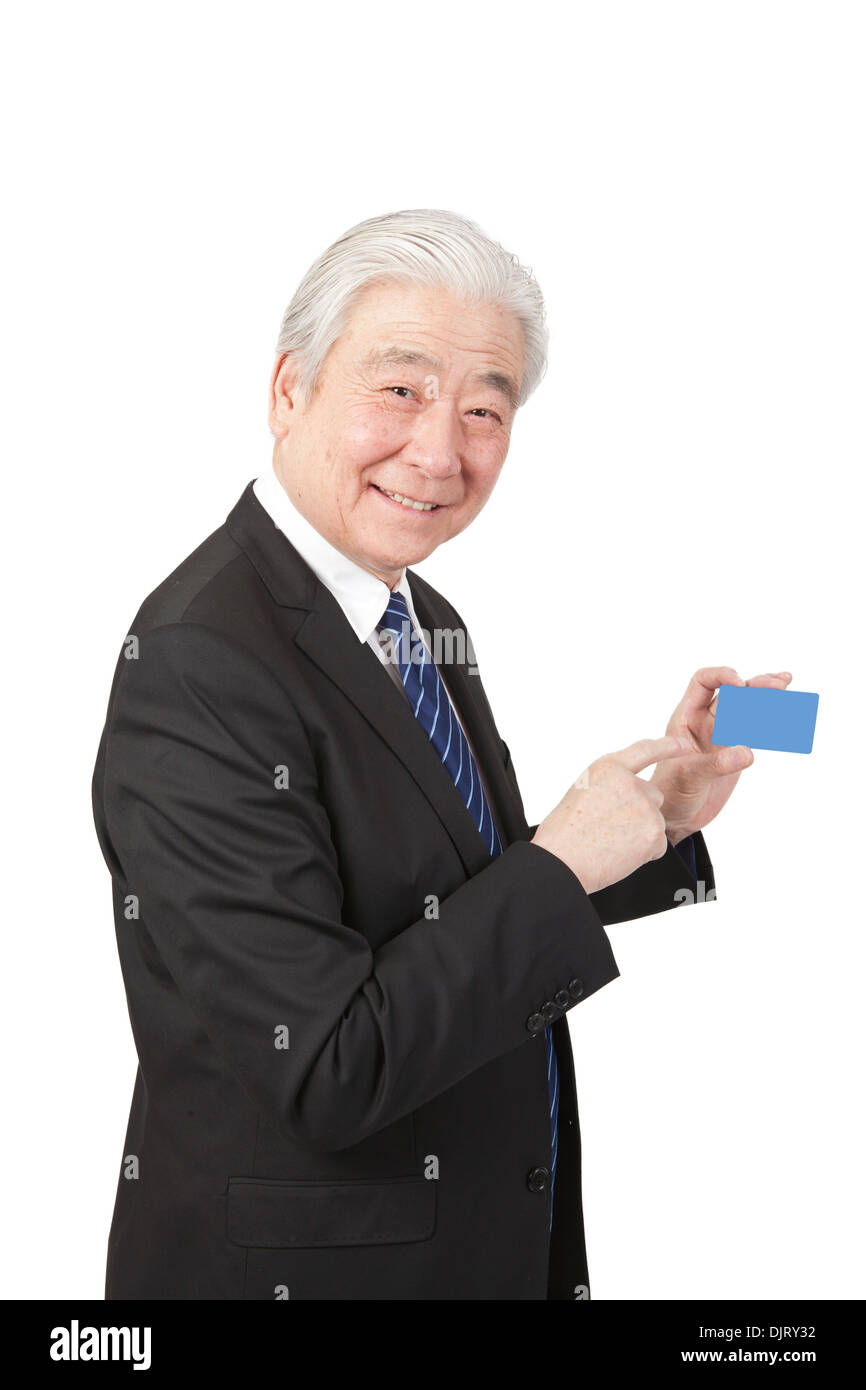 Senior businessman holding name card Stock Photo - Alamy