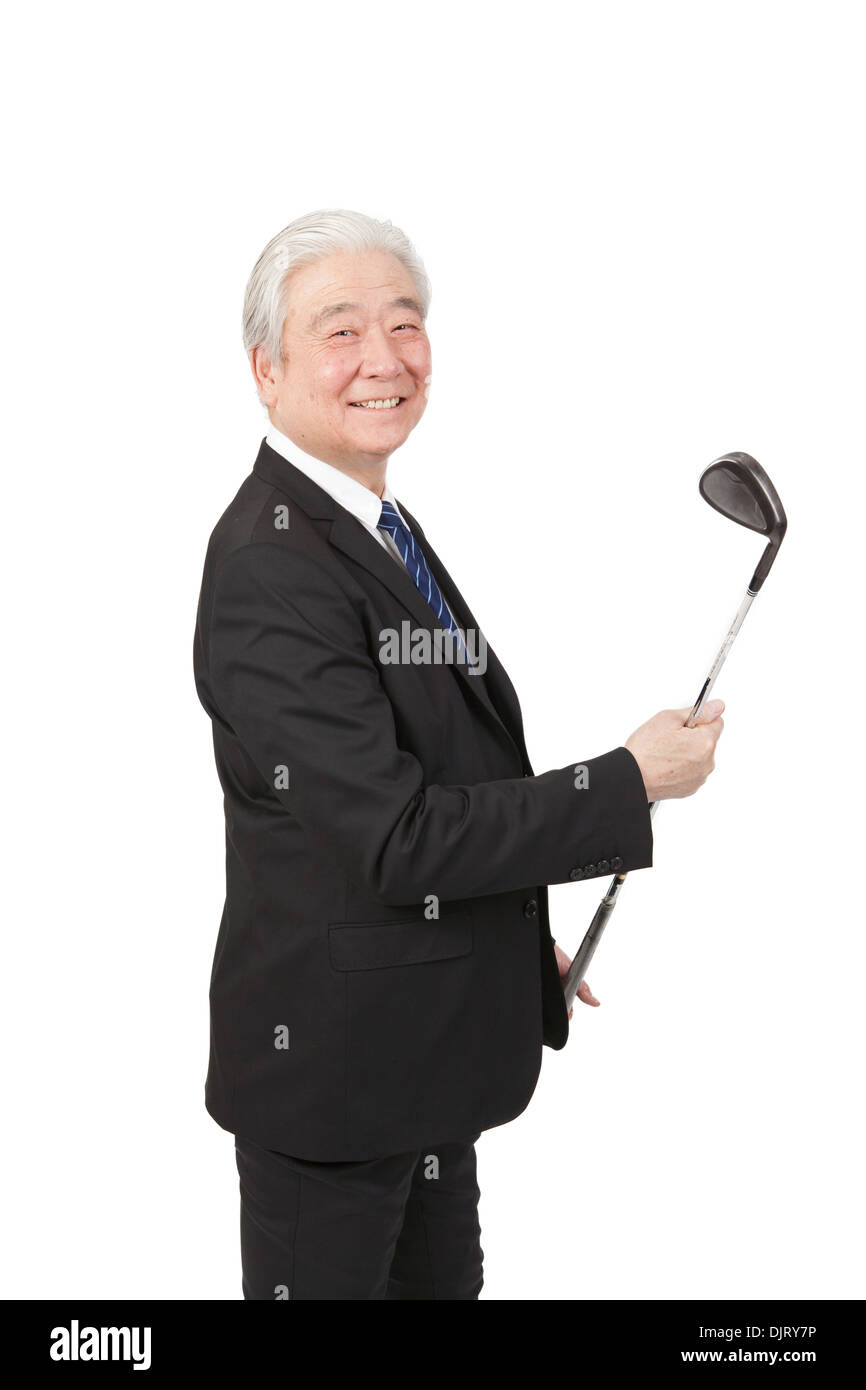 Senior businessman holding gulf club Stock Photo - Alamy