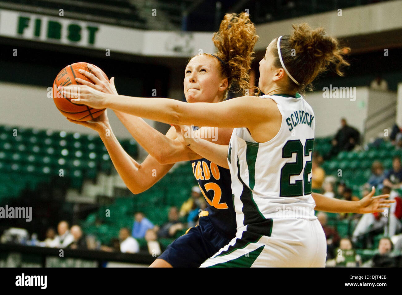 Toledo forward Melissa Goodall (32) and Eastern Michigan guard Cassie ...