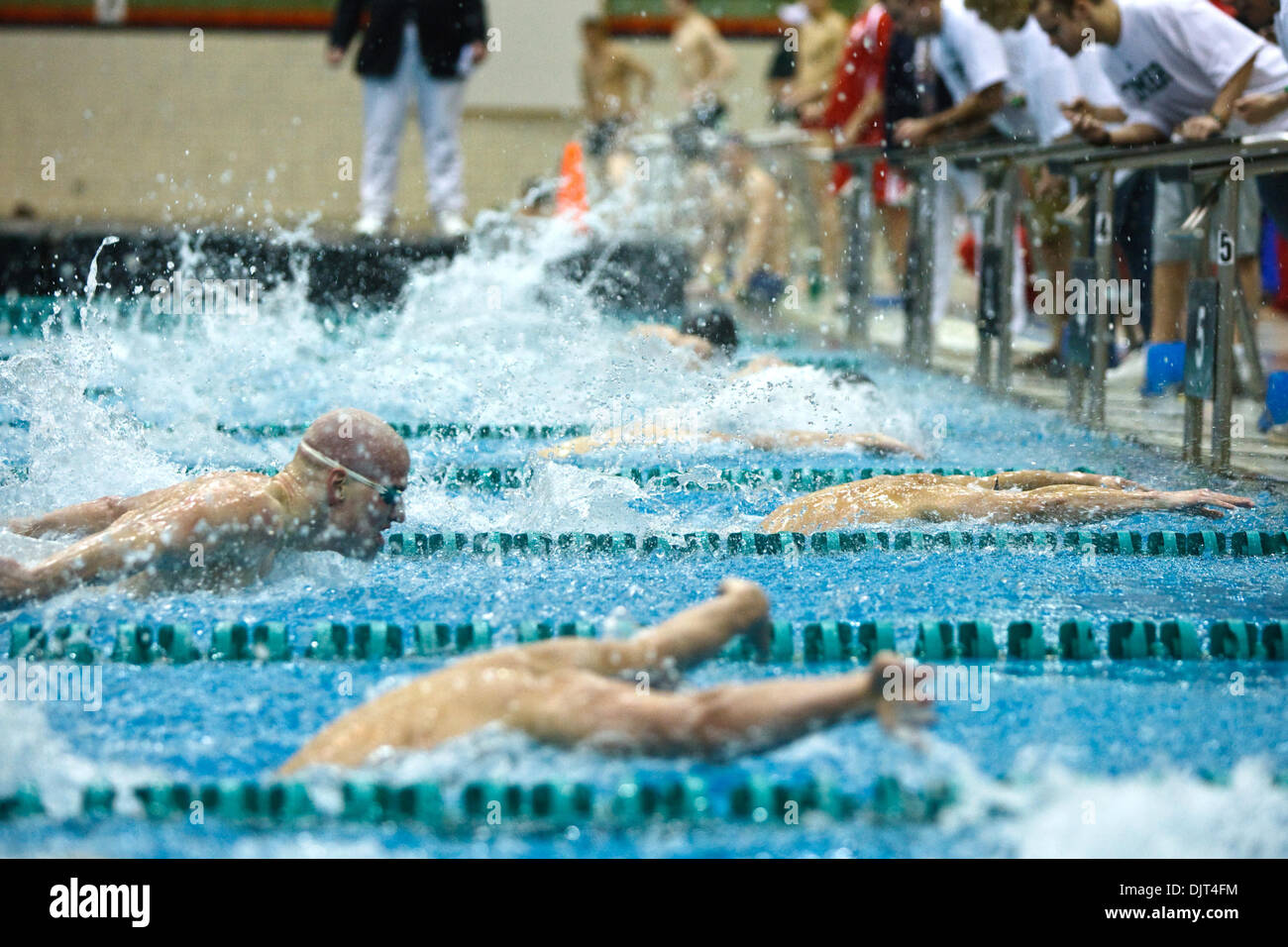 Swimmers in the consolation heat of the 100 Yard Butterfly event race ...