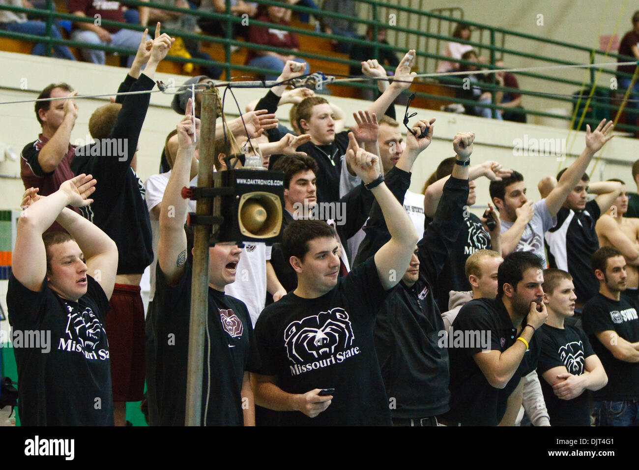Member of the Missouri State University team cheer on their teammates ...