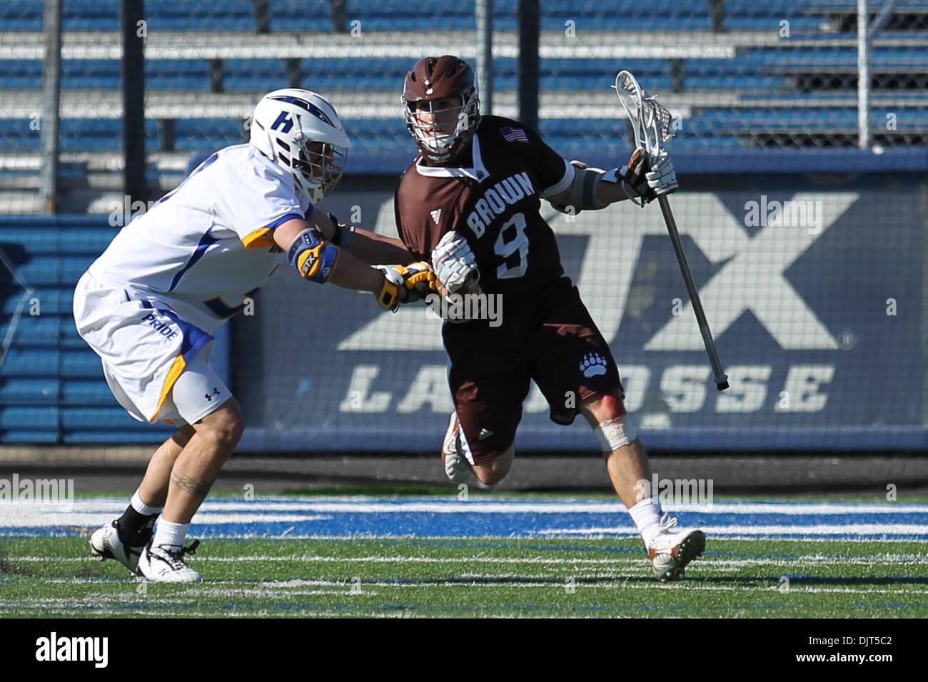 Brown Attack Thomas Muldoon (#9) gets checked by Hofstra Defender ...