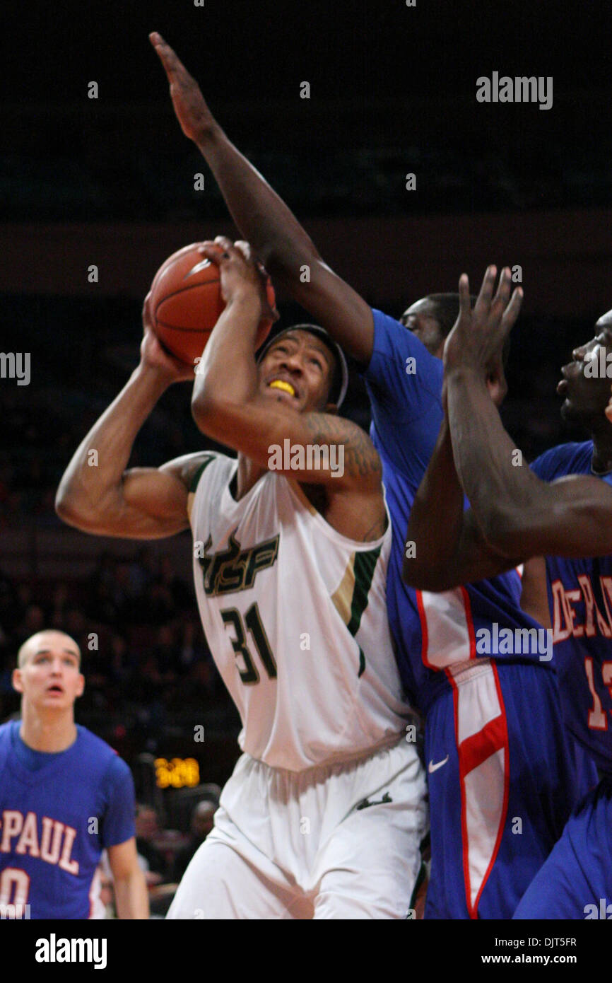 South Florida forward/center Jarrid Famous #31 looks to the net. USF ...