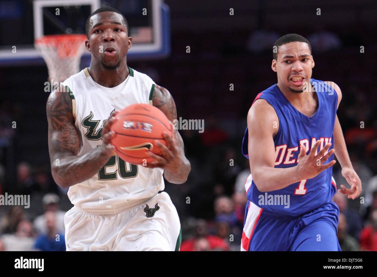 South Florida guard Dominique Jones #20 and DePaul forward Mike Stovall ...