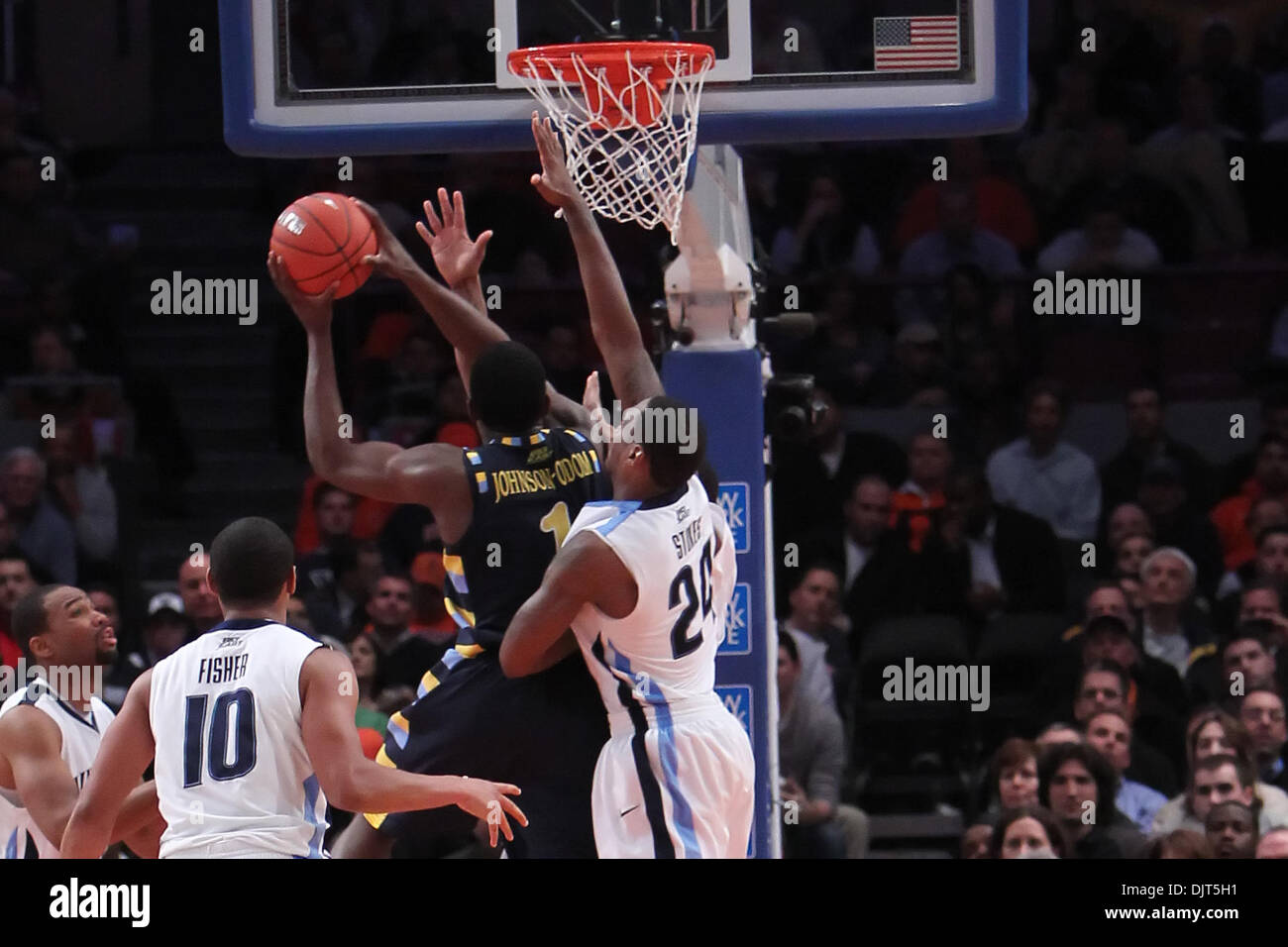 Marquette guard Darius Johnson-Odom #1 goes for the net. Marquette ...