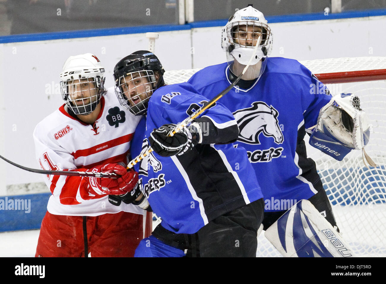 Miami center Carter Camper (11) battles defenseman Davide Nicoletti (28 ...